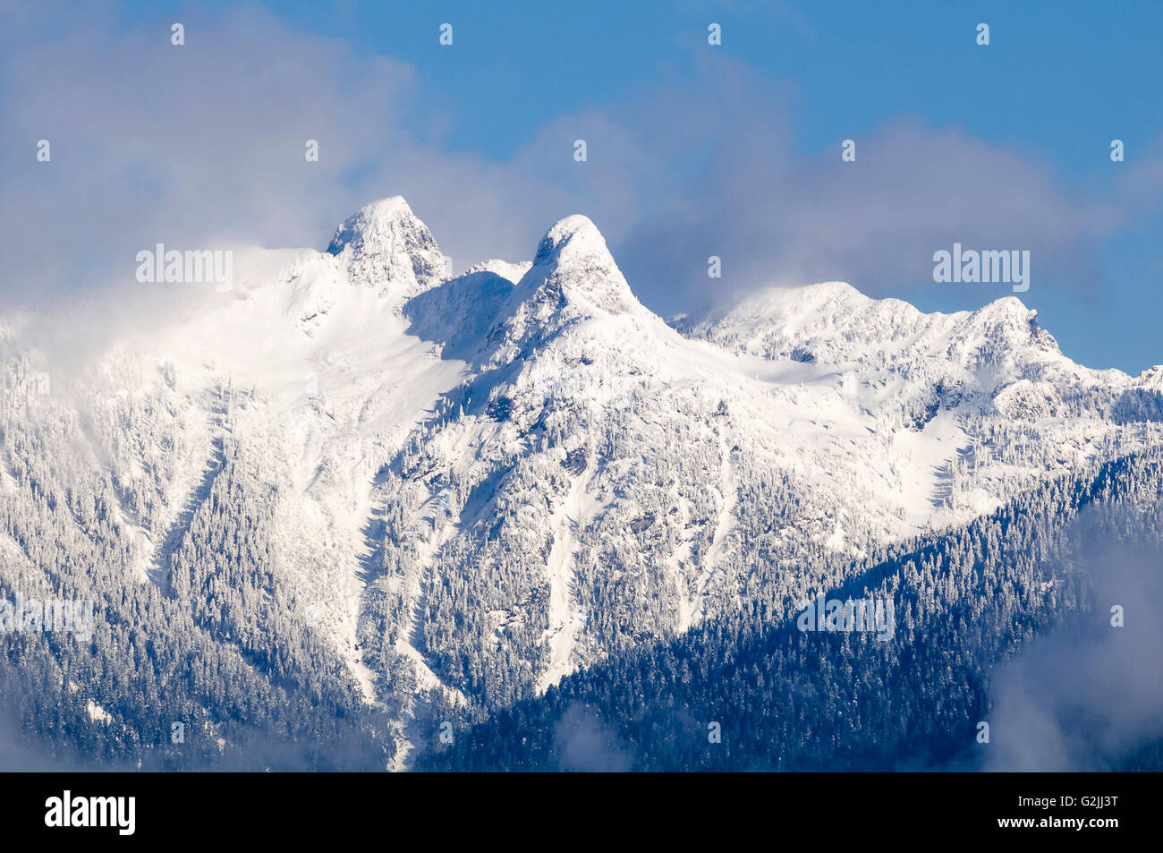The Lions, famous North Shore mountain landmarks, seen from Vancouver ...