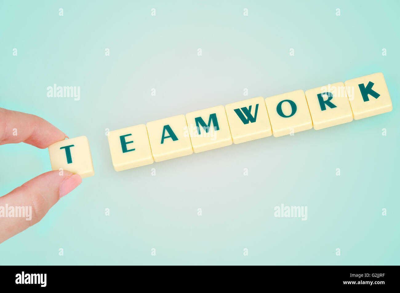 Teamwork word on blue background Stock Photo - Alamy