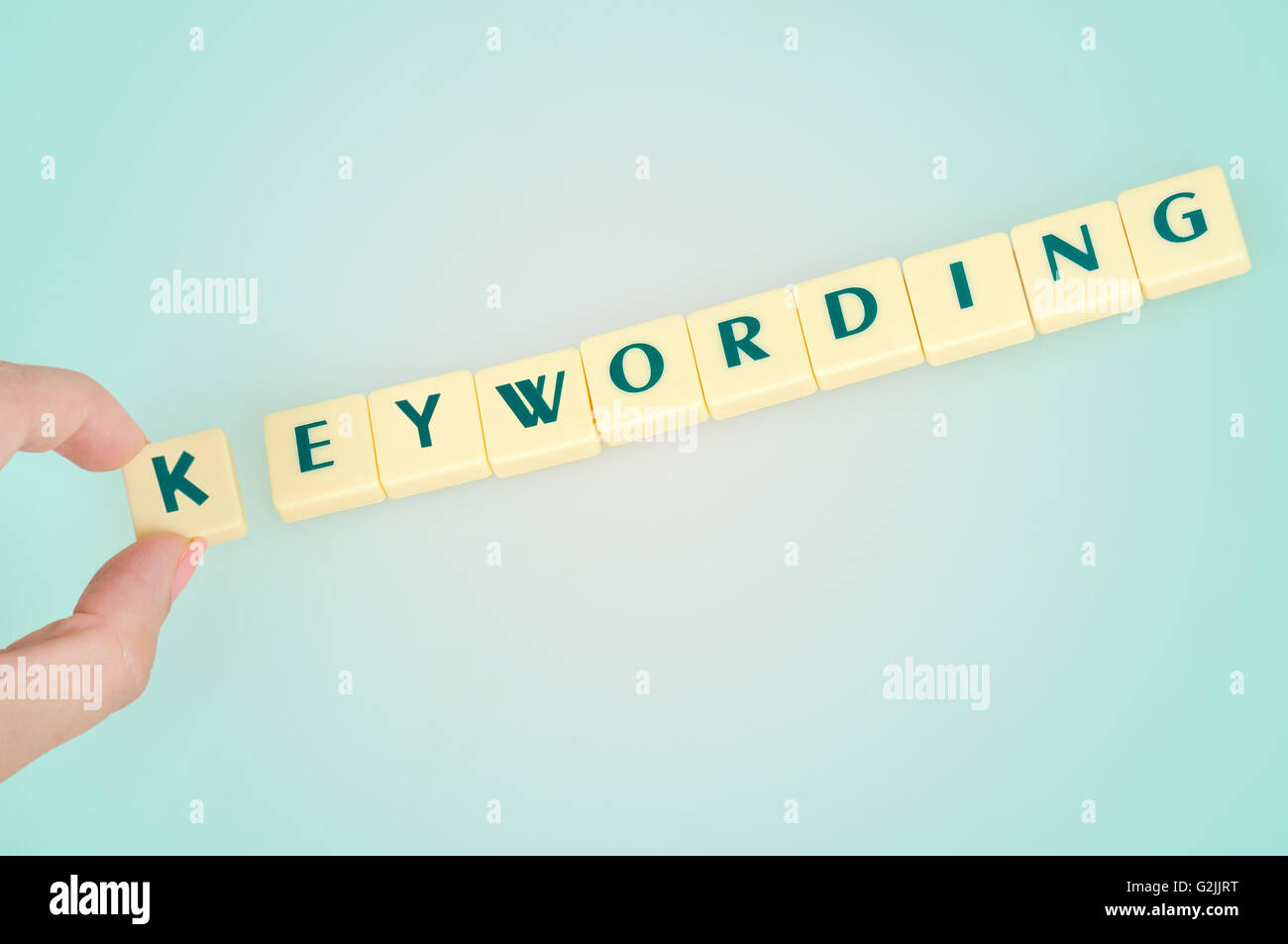 Keywording word on blue background Stock Photo - Alamy