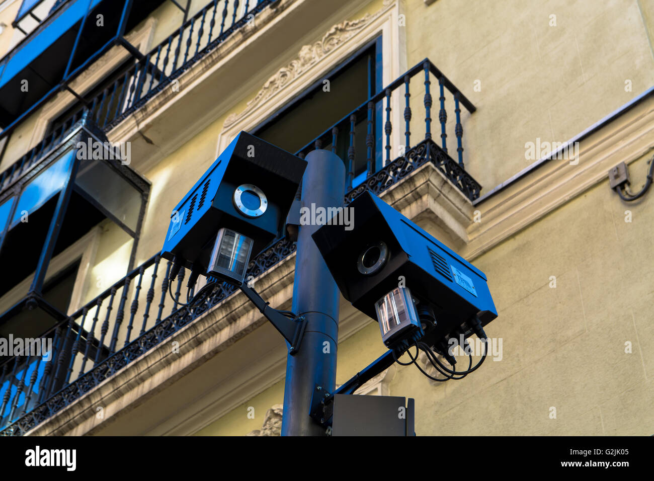 Low Angle View Of CCTV Security Cameras Against Building In Street ...
