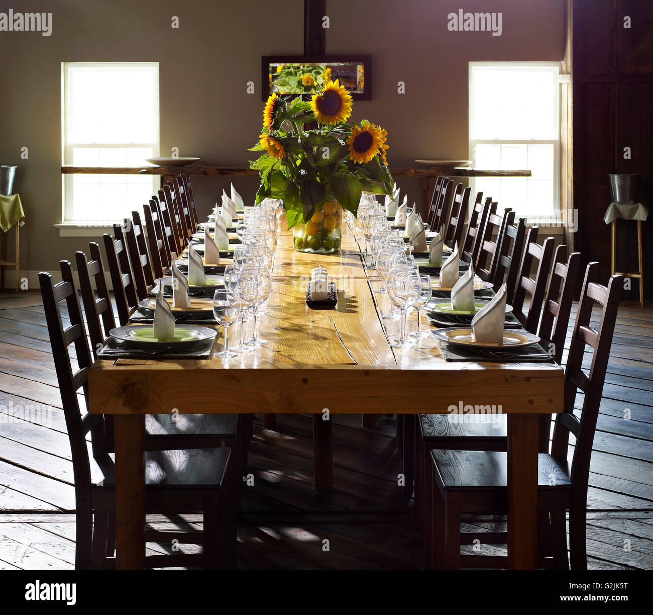 Long Dining Table With Place Settings Stock Photo - Alamy