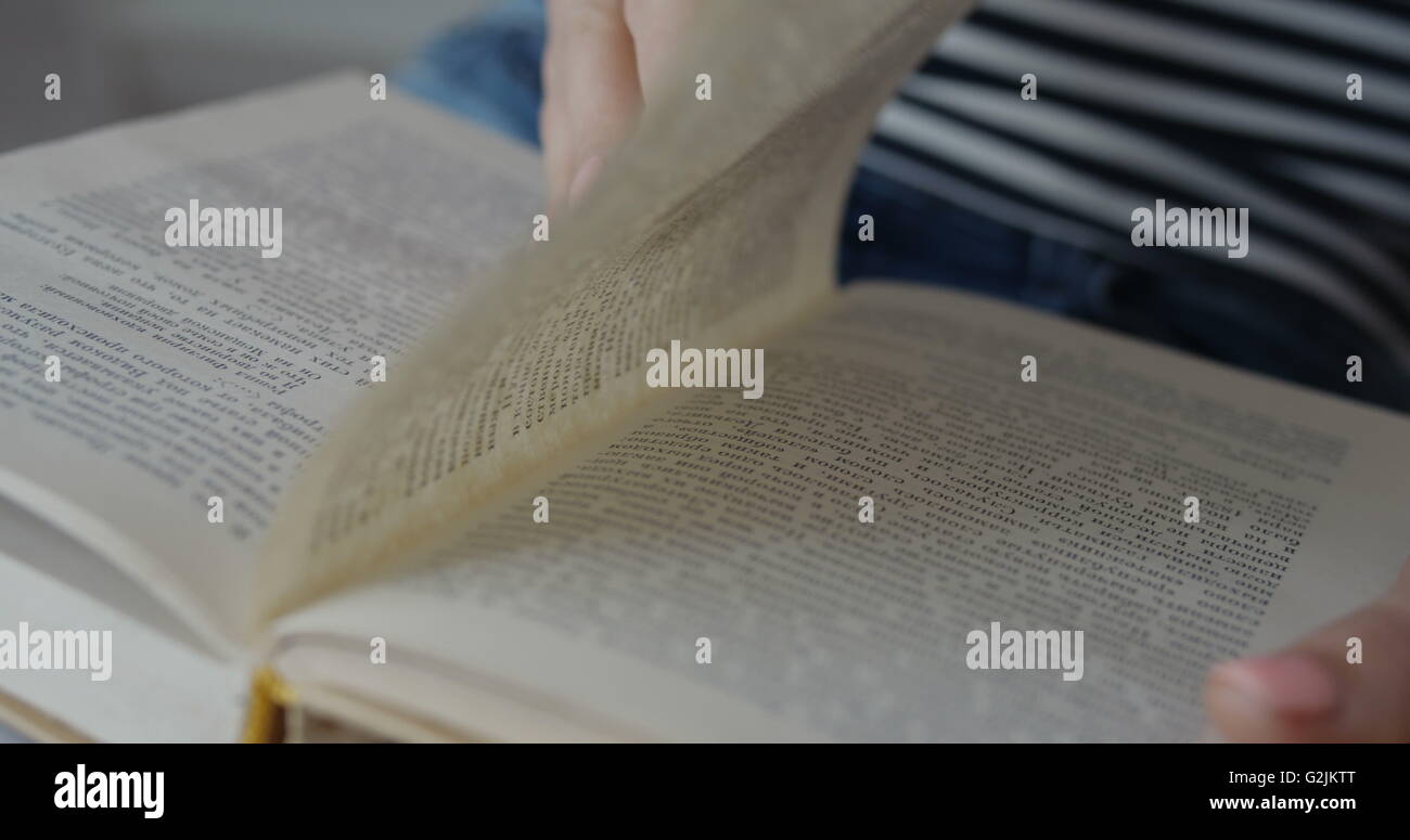 Turning page girl hi-res stock photography and images - Alamy