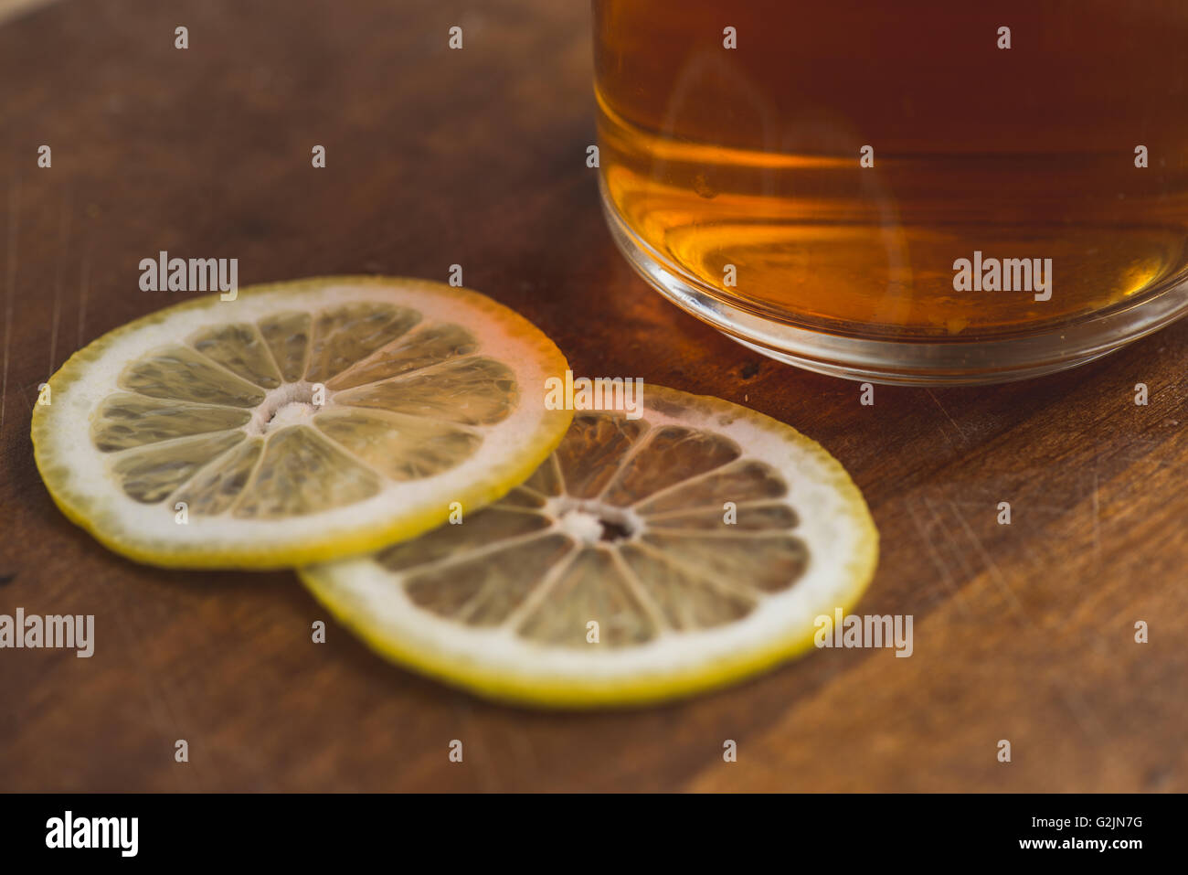 Top view of black tea with lemon in cup and on wooden plank table Stock ...
