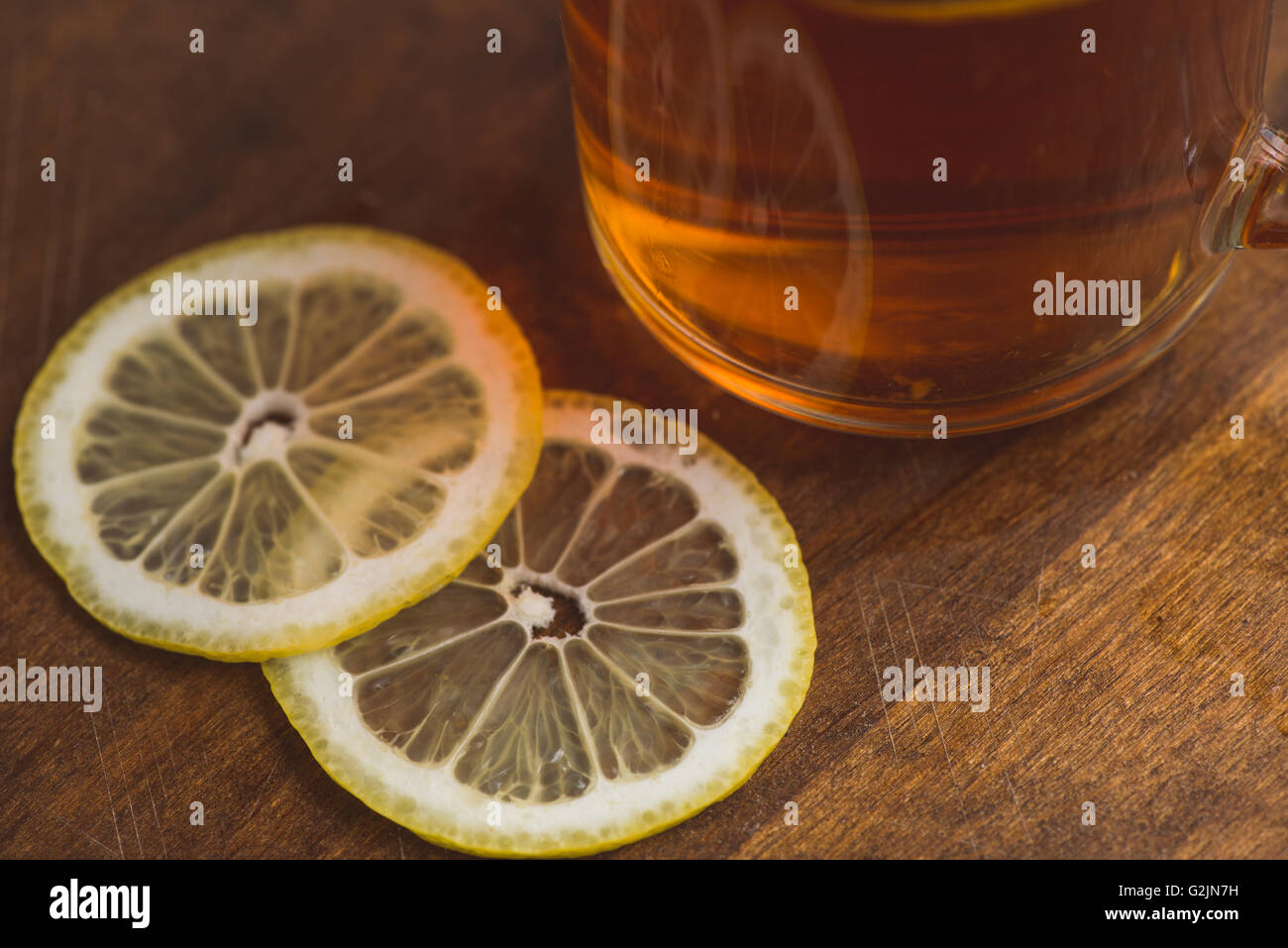 Top view of black tea with lemon in cup and on wooden plank table Stock ...