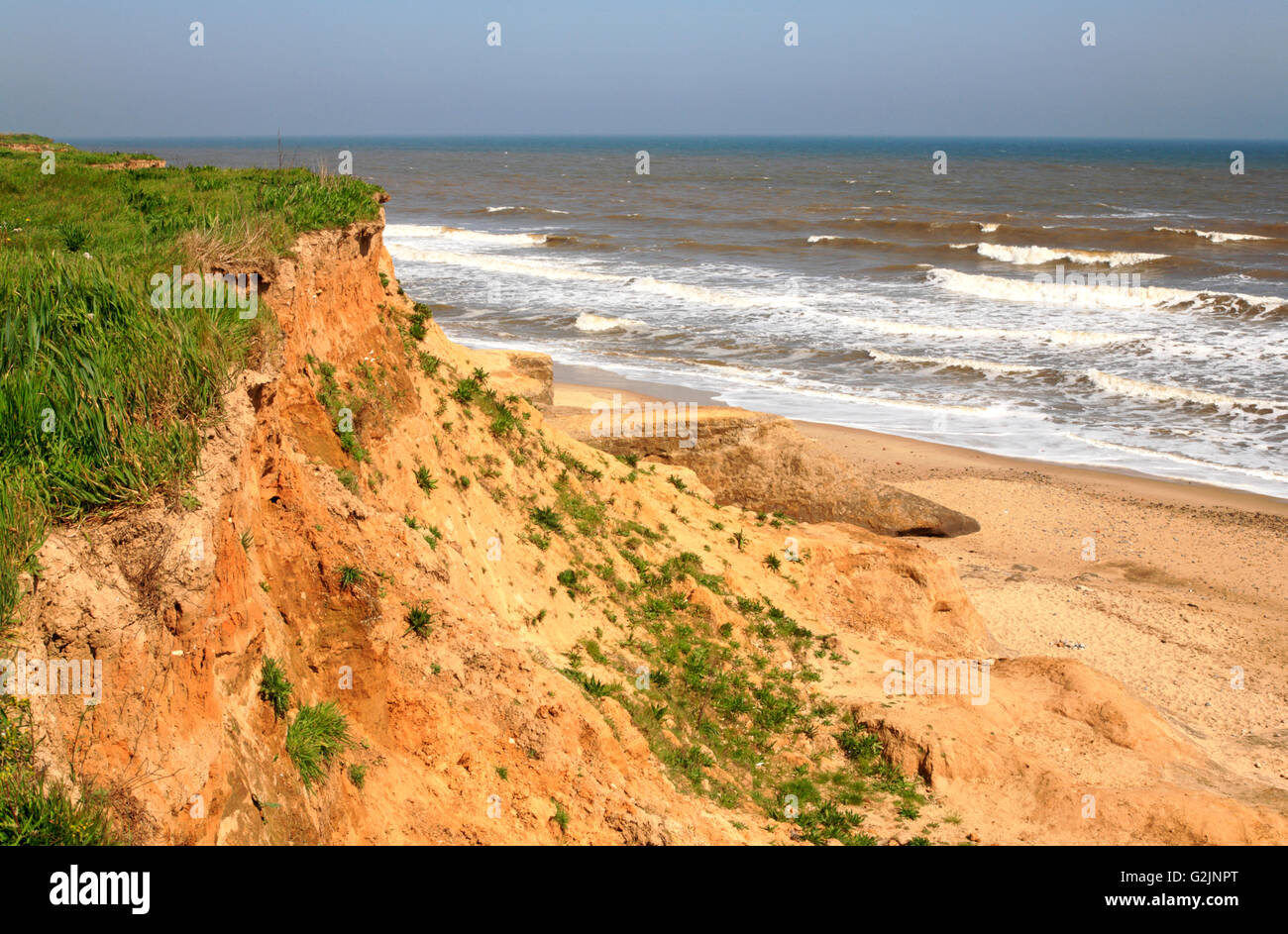 A view of the cliffs and beach on the Norfolk coast at Happisburgh ...