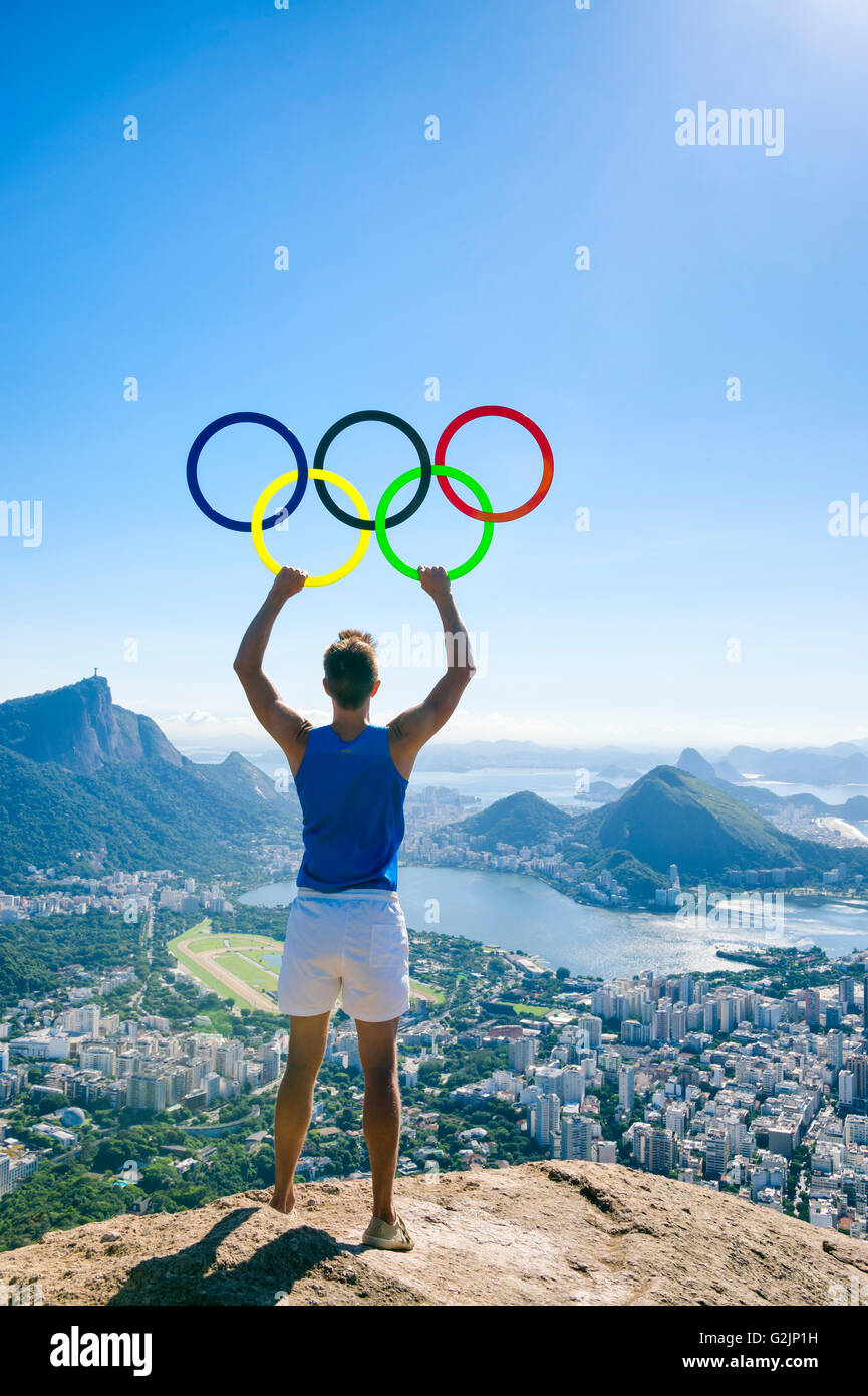 RIO DE JANEIRO - MARCH 21, 2016: An athlete holds Olympic rings under ...