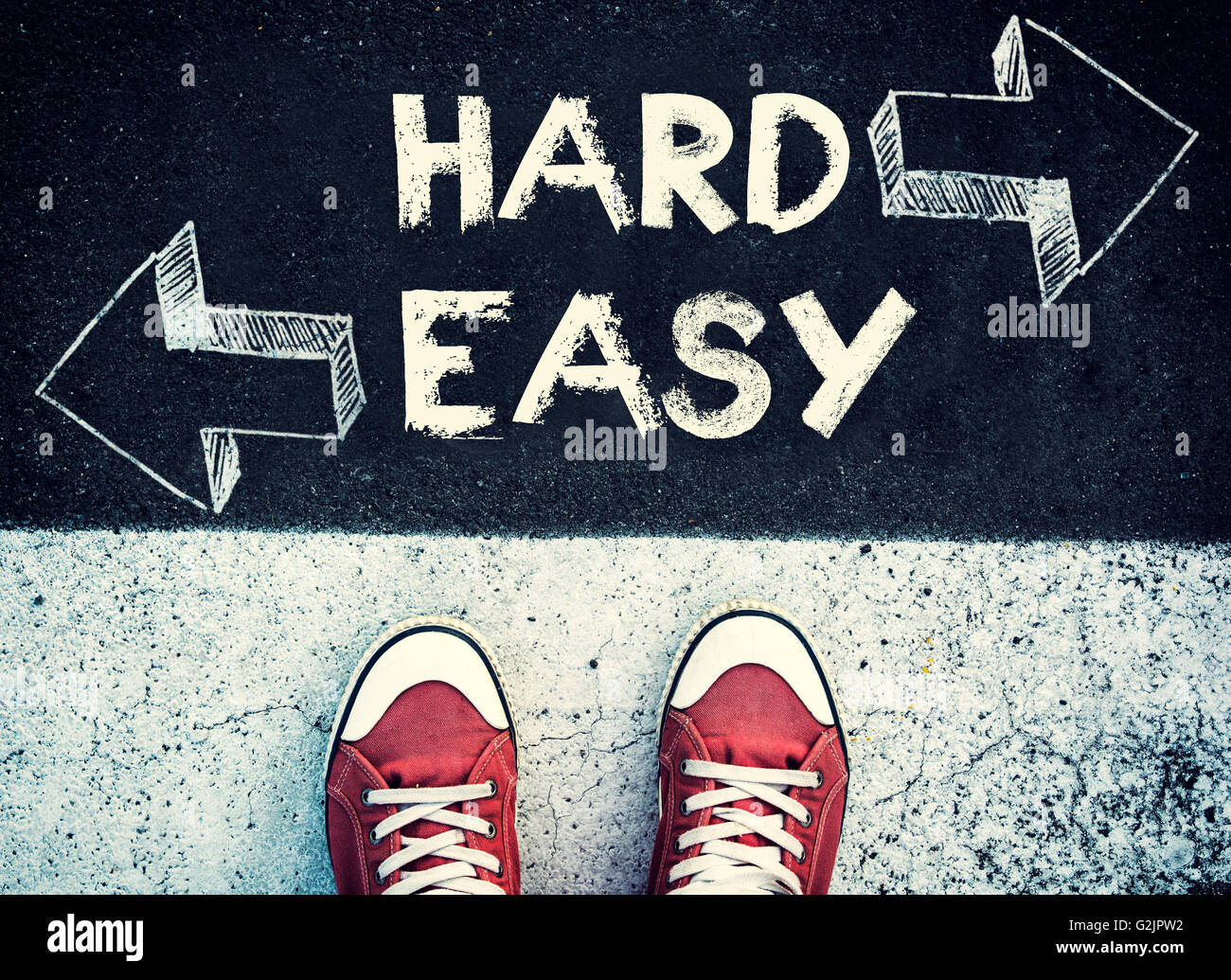 Student standing above the hard and easy sign,dilemma concept Stock ...