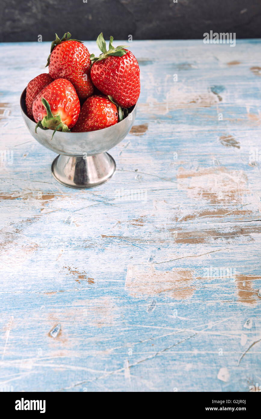 Fresh and organic strawberries on wooden background with empty space ...