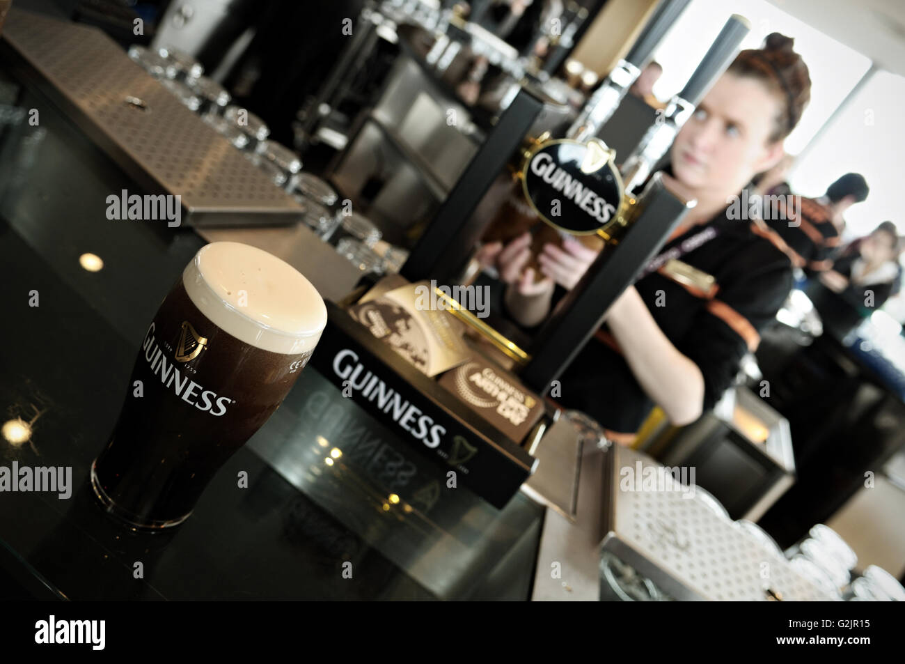Bartender and pint of Guinness at the Gravity Bar inside the Guinness ...