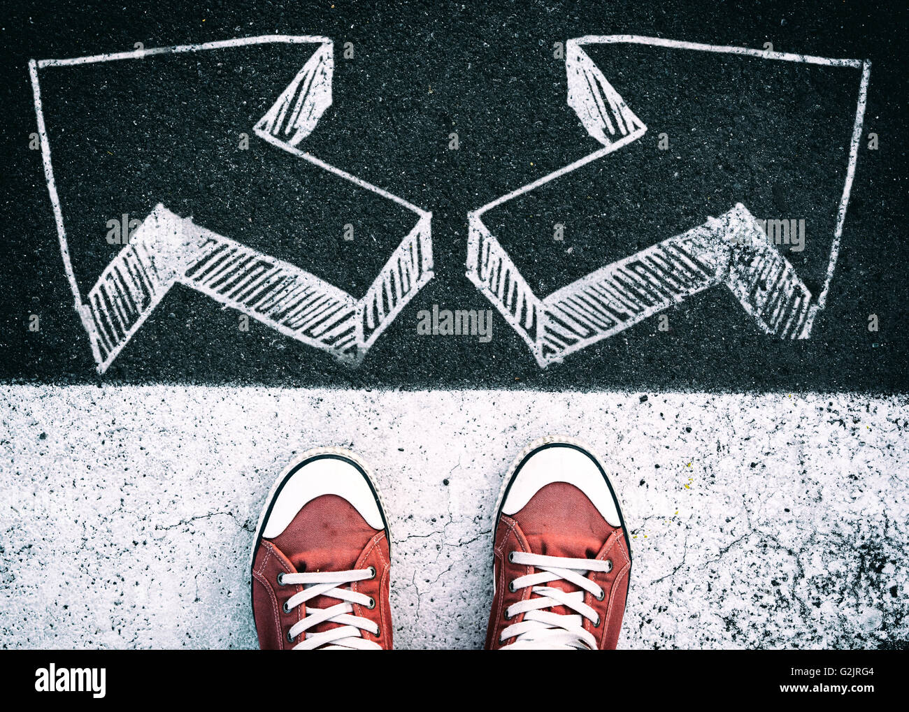 Student standing above the dilemma sign Stock Photo - Alamy