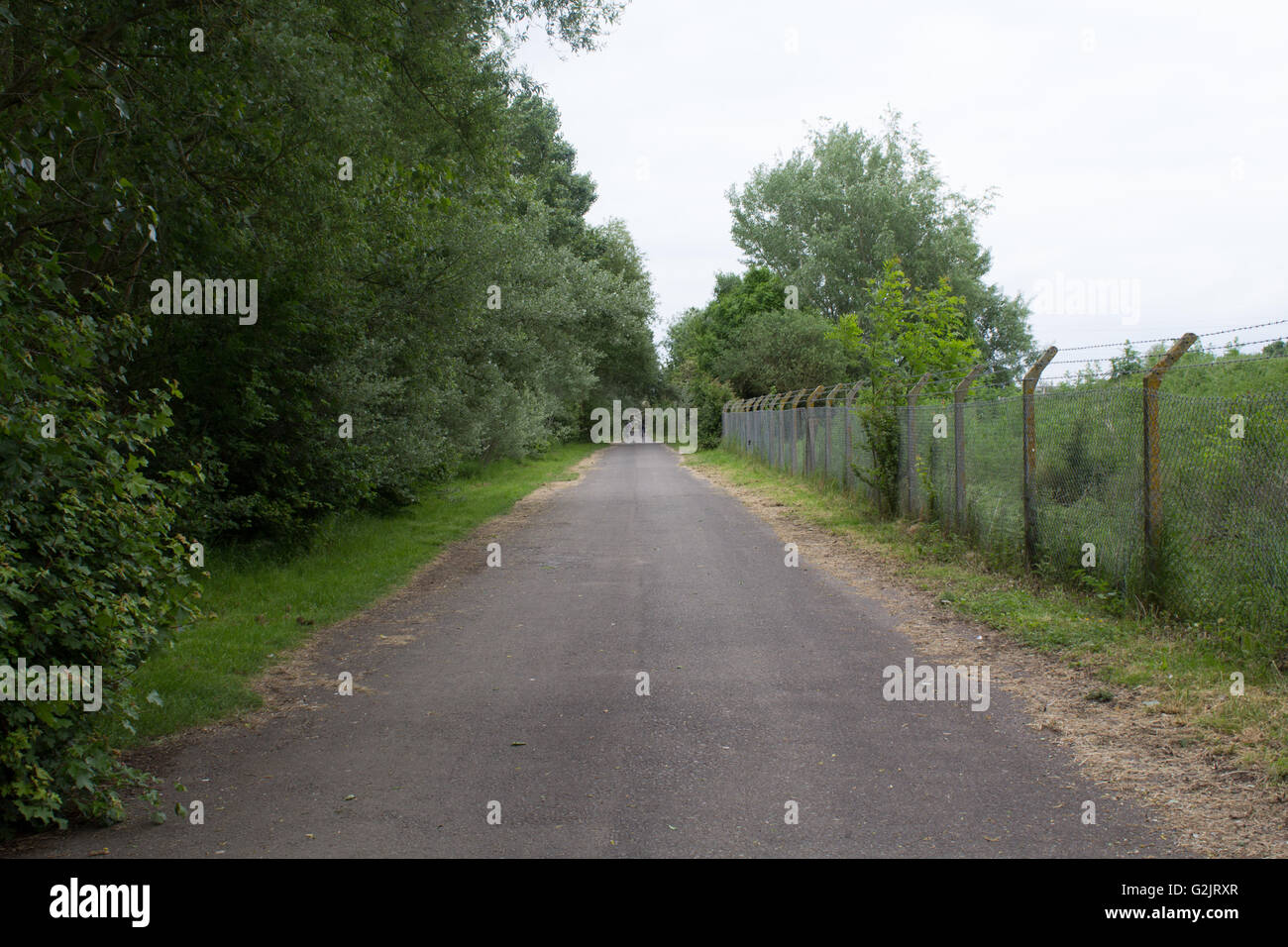 Concrete perimeter road outside a sewage treatment works in Abingdon ...