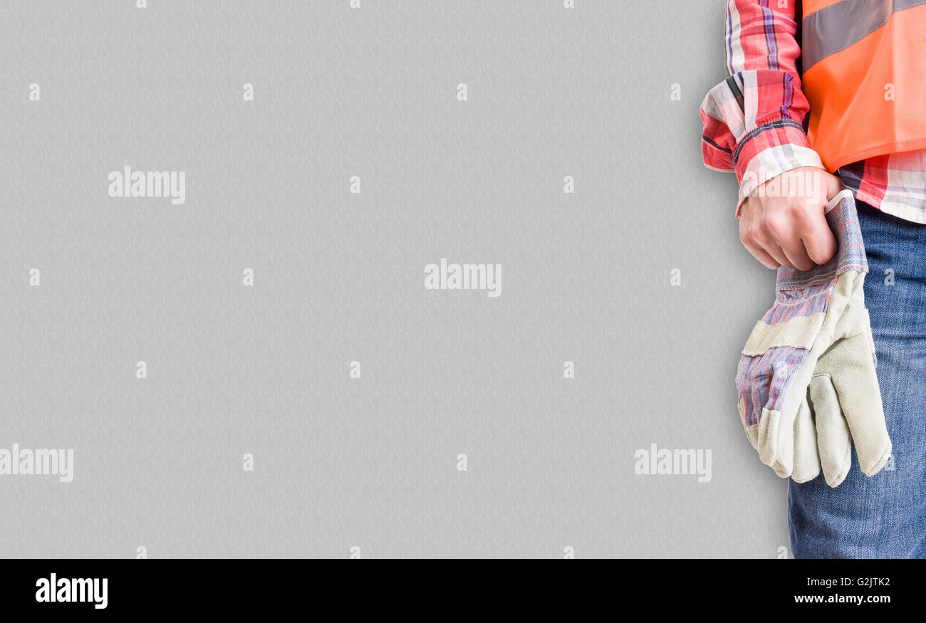 Close-up of constructor hand holding his protection glove and wearing ...