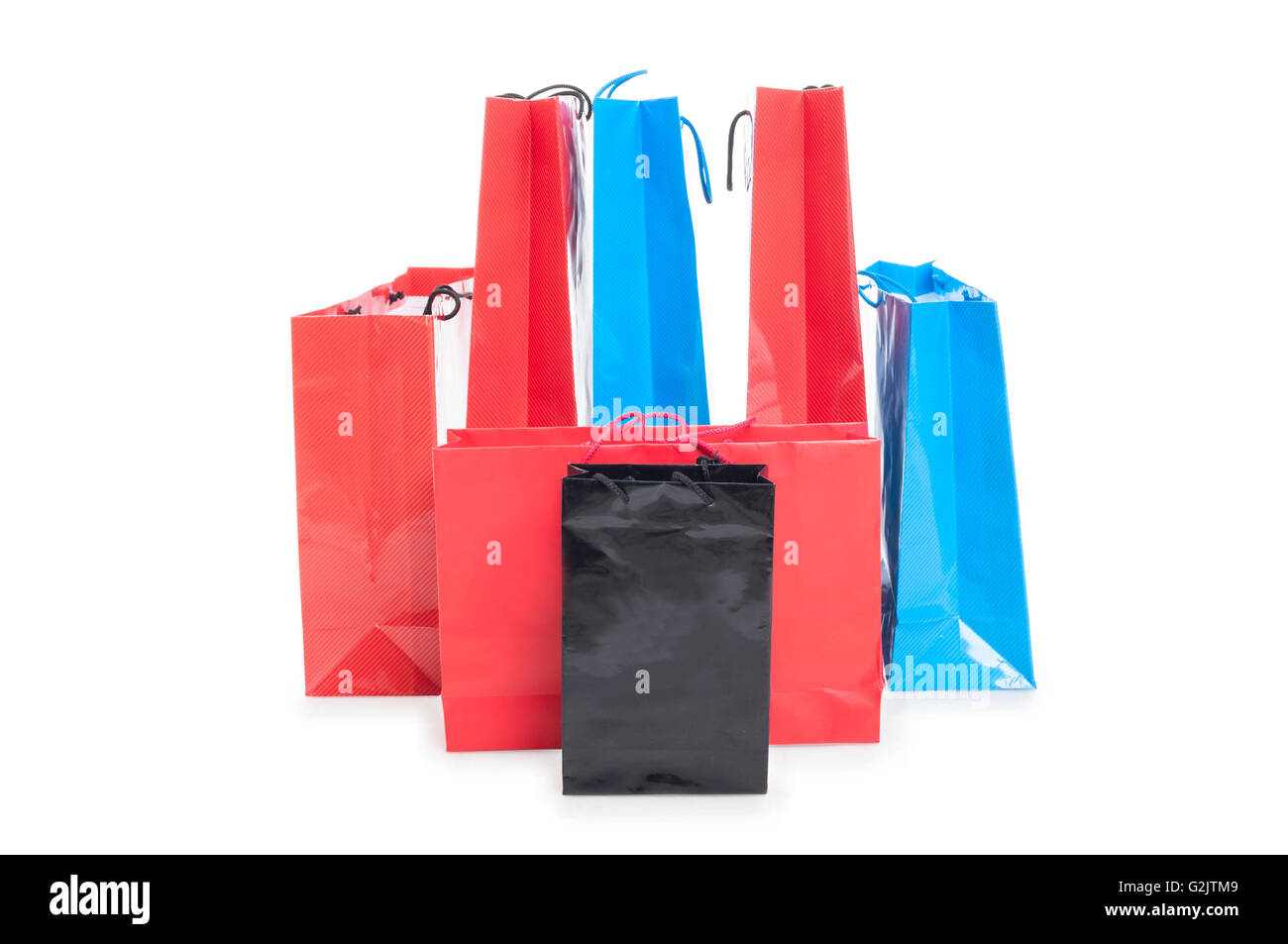 Assorted colored shopping bags included red, blue and black on a white ...