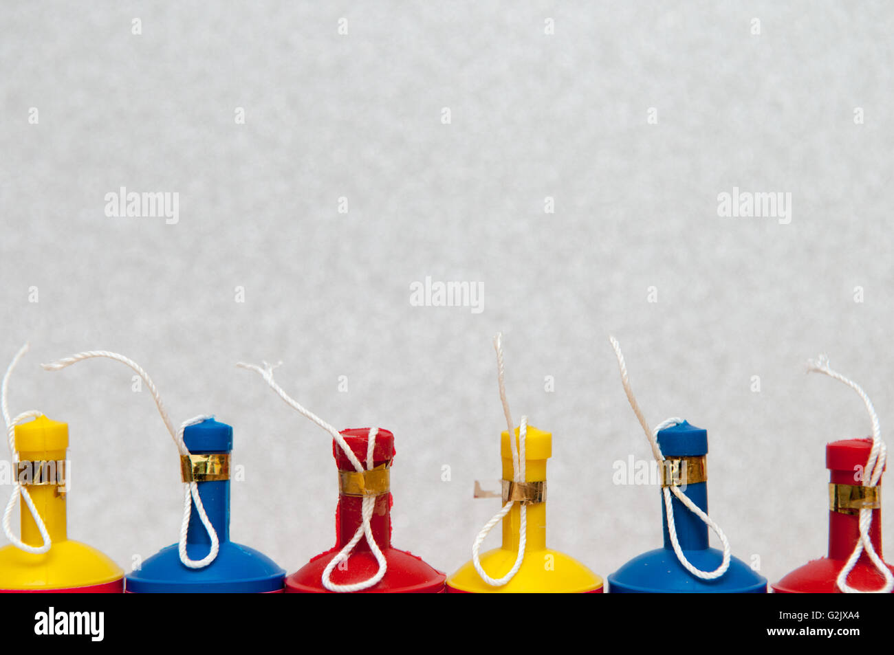 Colorful party poppers arranged in a row on a bright background Stock ...