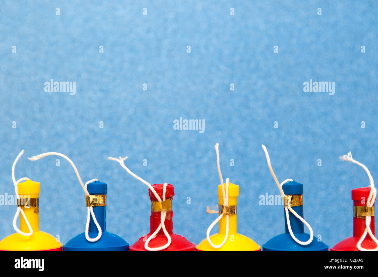 Colorful party poppers arranged in a row on a bright background Stock ...