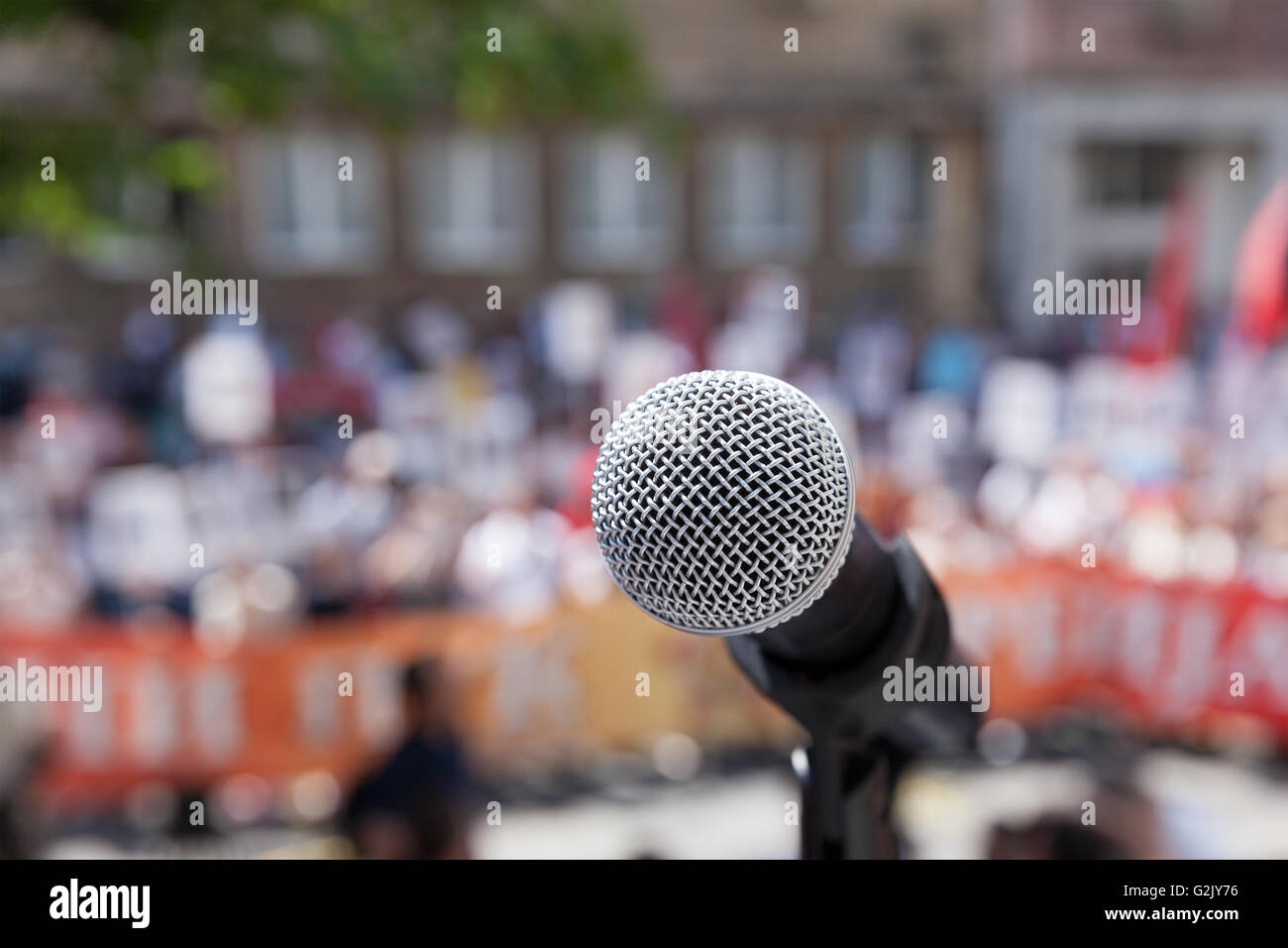 Microphone in focus against unrecognizable crowd Stock Photo - Alamy