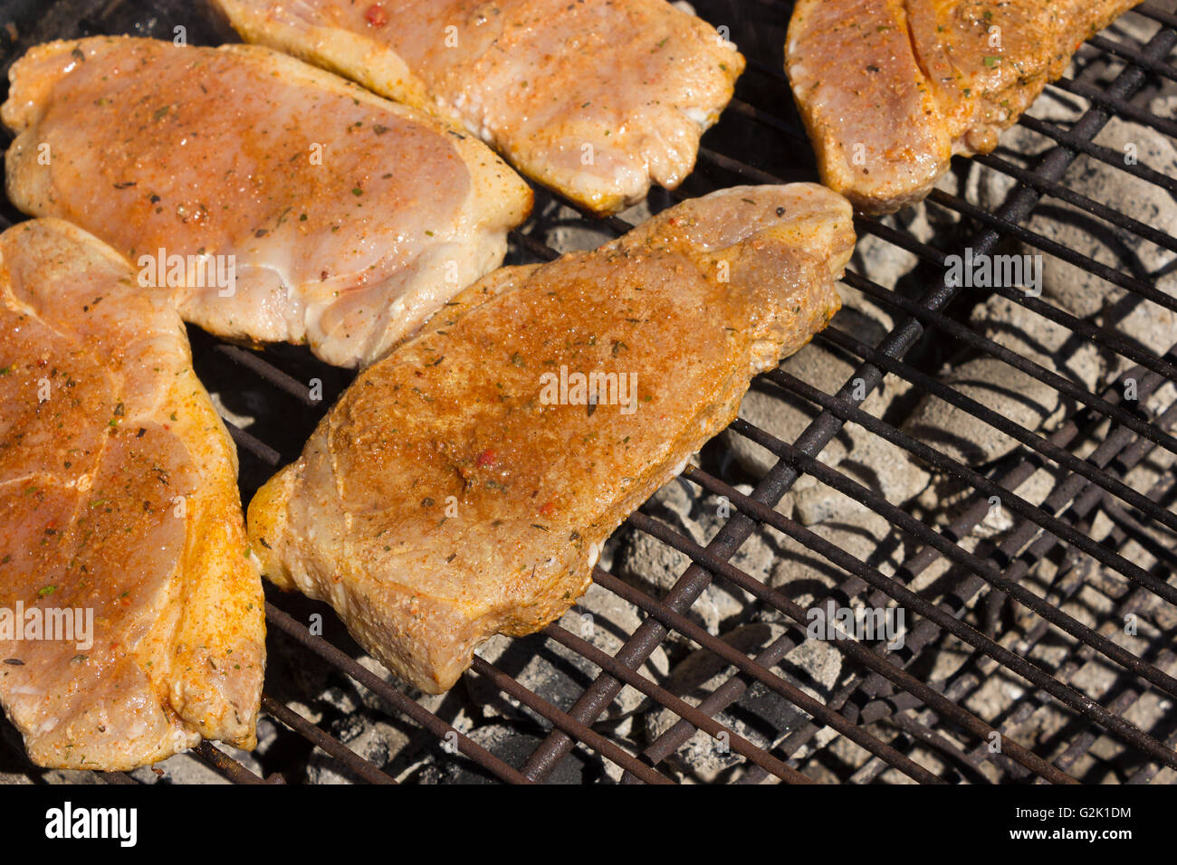 Barbecue at dusk, charcoal and smoke, delicious dinner Stock Photo - Alamy