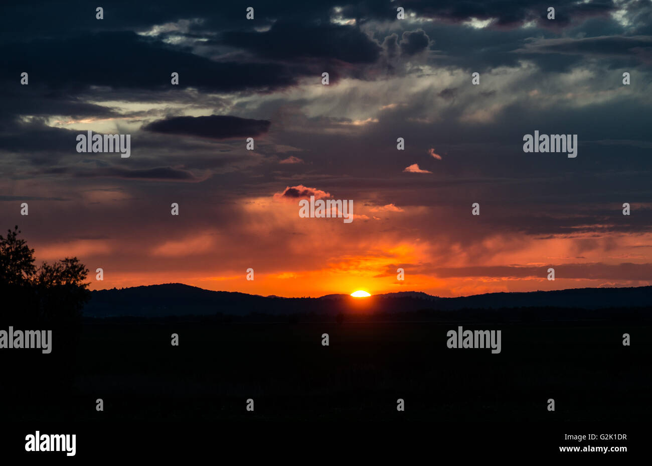 Hills landscape with sunset Stock Photo - Alamy