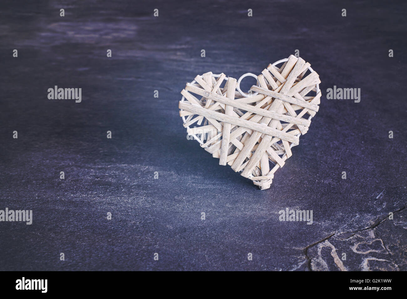 Vintage stylized heart on grunge stone background, shallow depth of ...