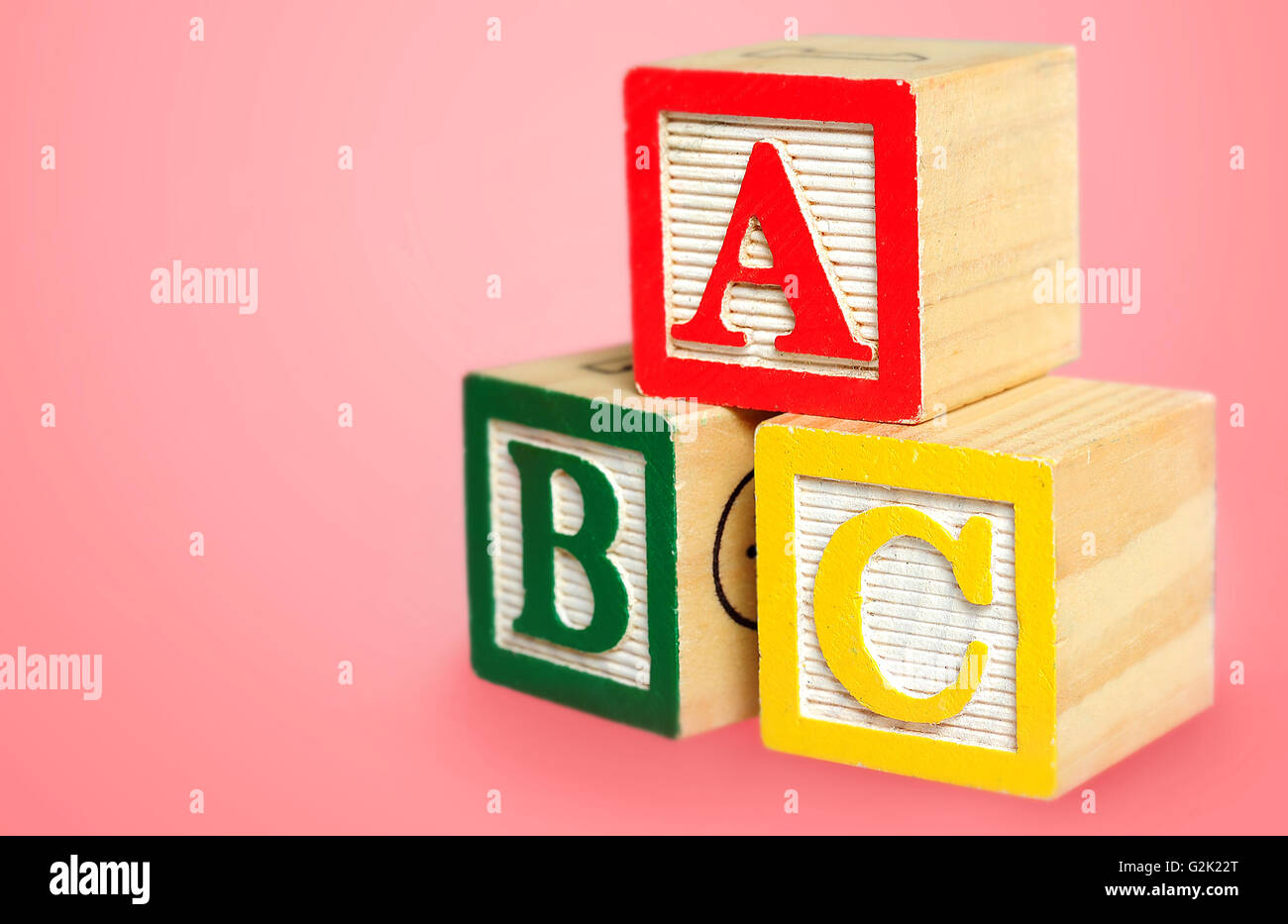 Cube pyramide on pink background Stock Photo - Alamy