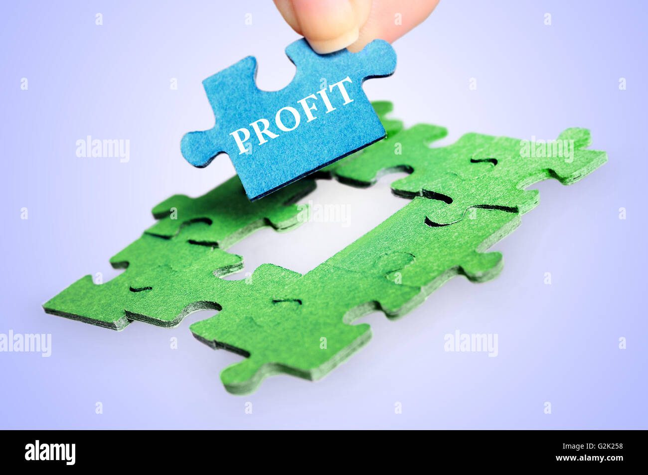 Puzzle with Profit word piece Stock Photo - Alamy