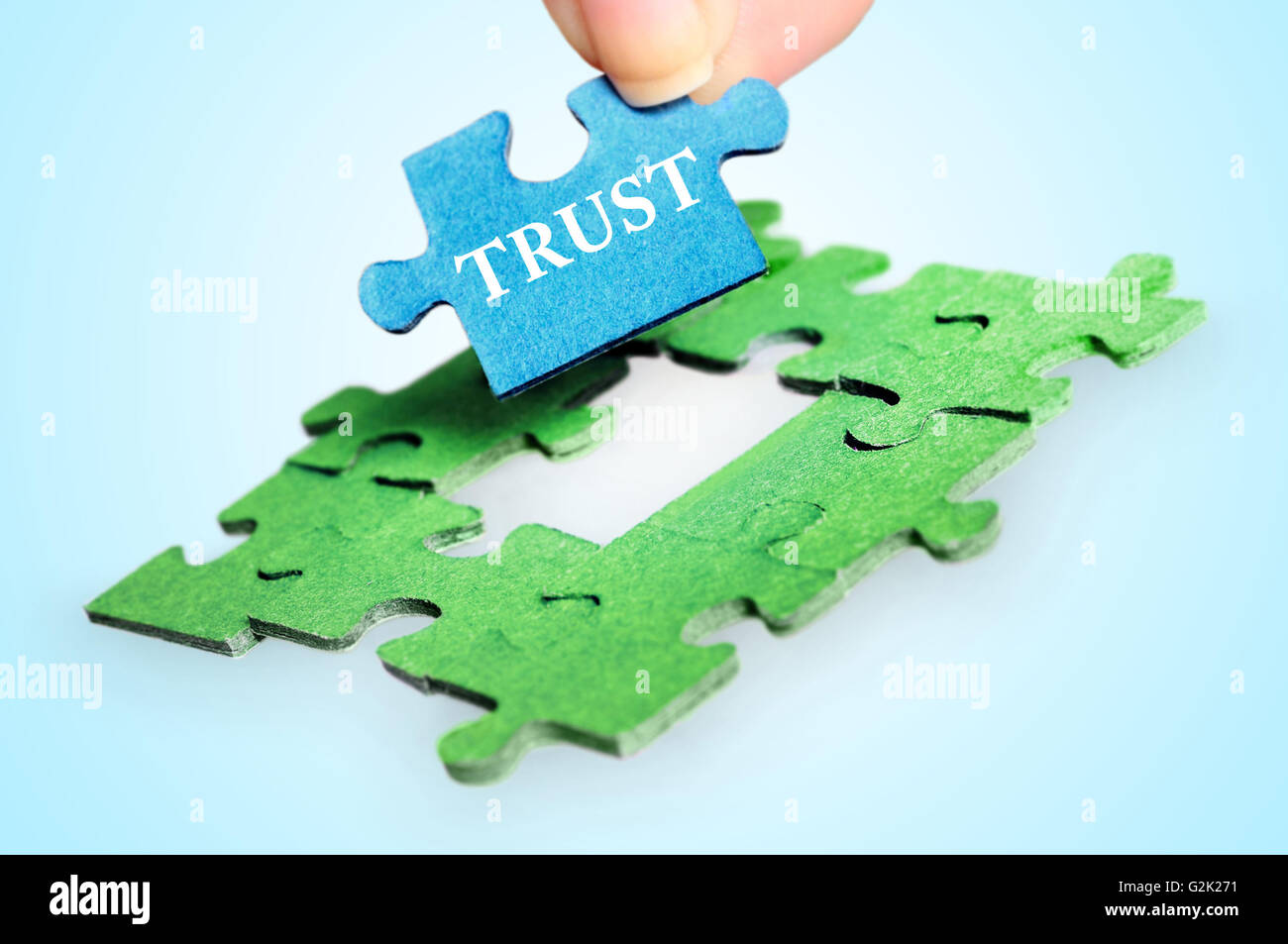 Puzzle with Trust word piece Stock Photo - Alamy