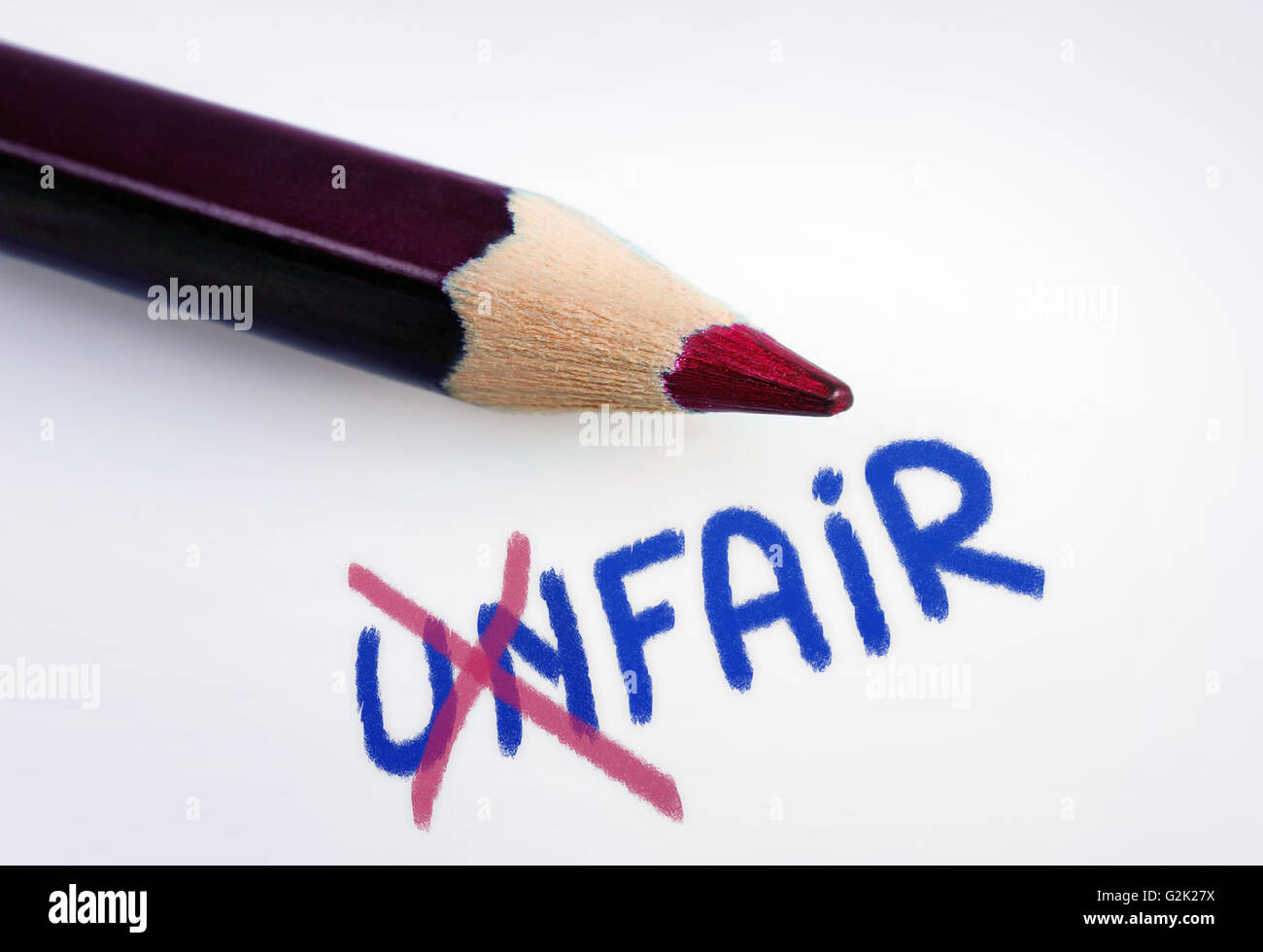 Unfair word on grey background Stock Photo - Alamy