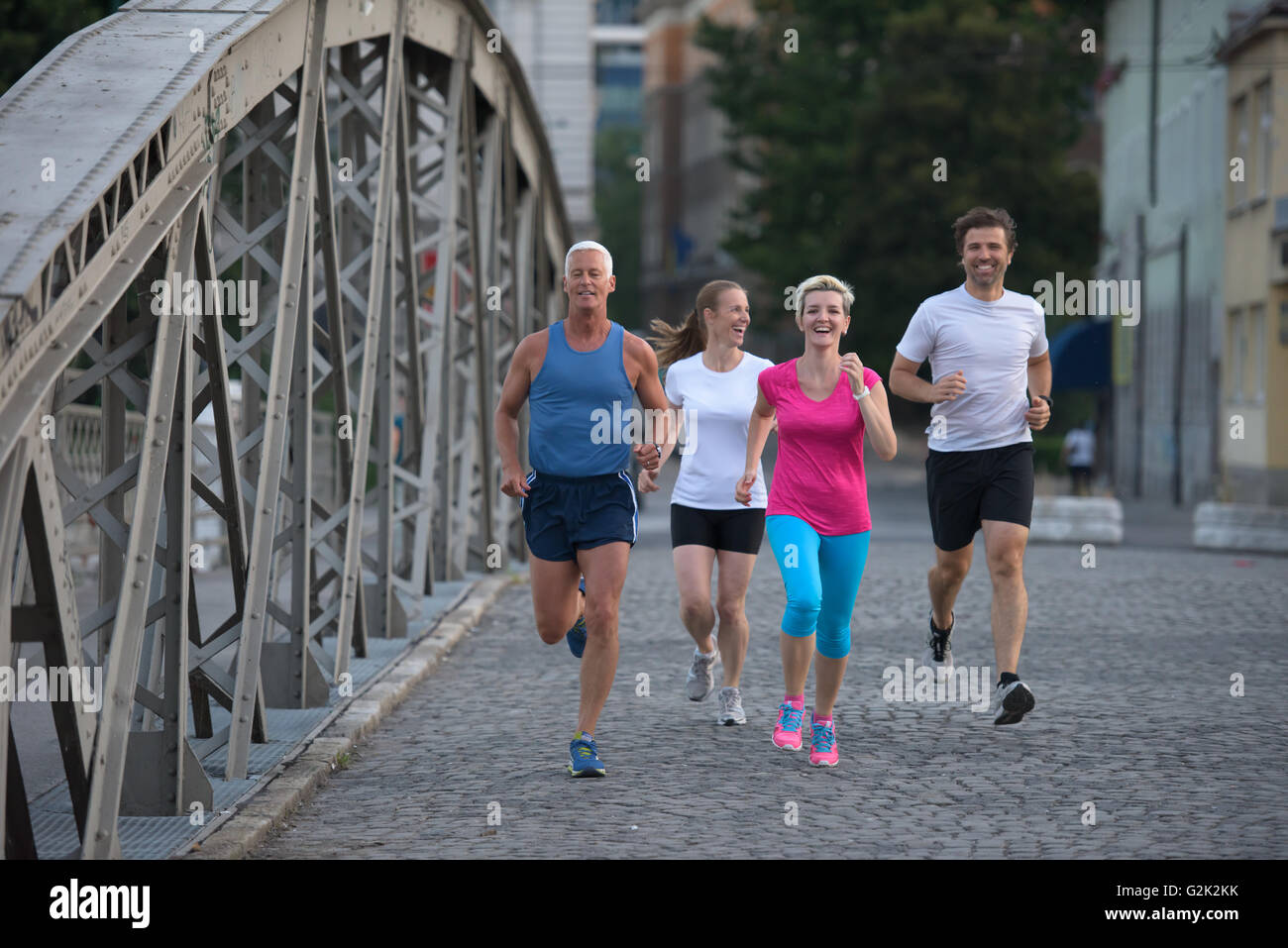 people group jogging runners team on morning training workout with ...