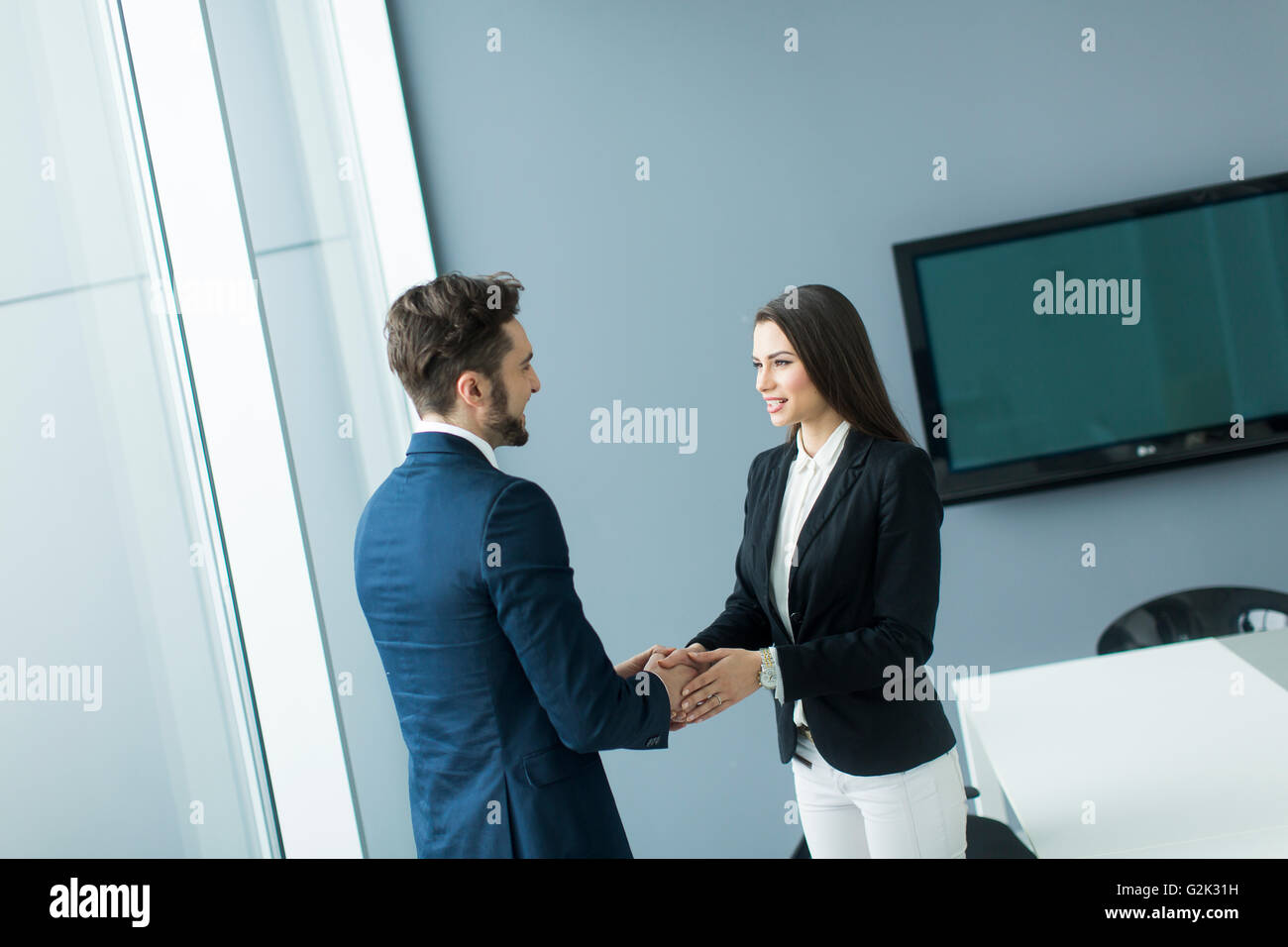 Business people shaking hands in the office Stock Photo - Alamy