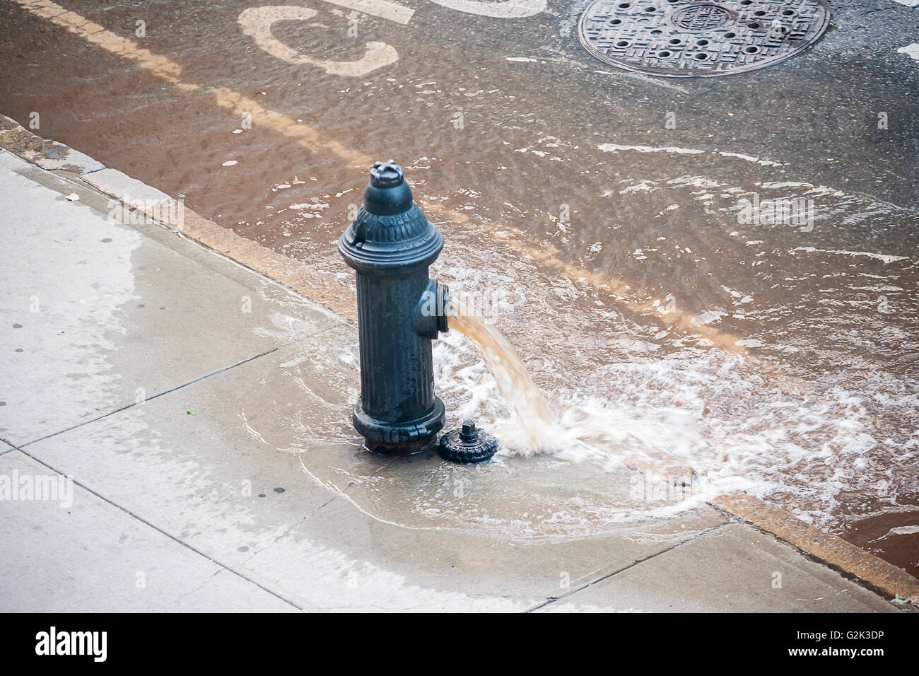 Water gushes from an open fire hydrant in in New York on Tuesday, May ...