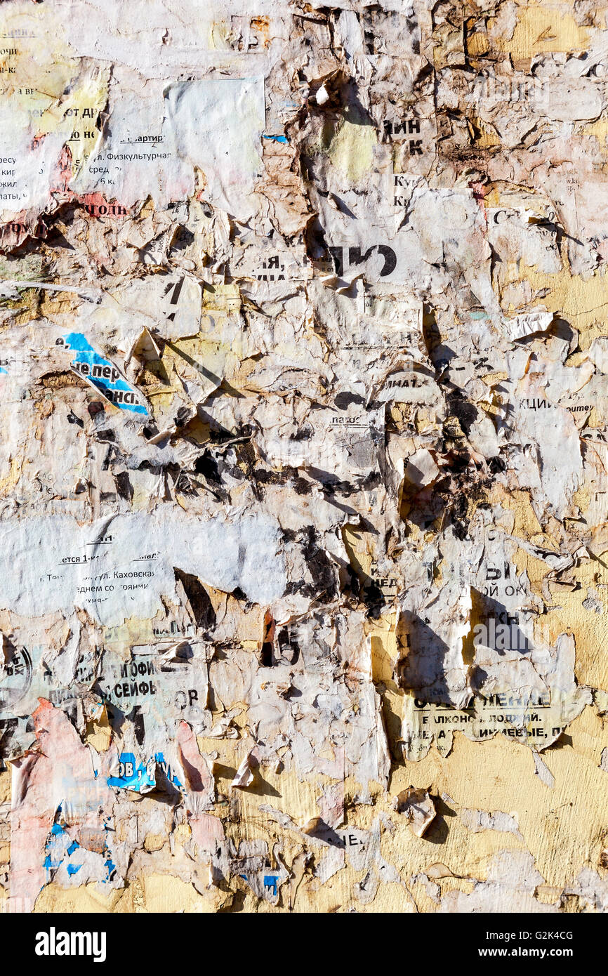 Wall with scraps of old paper as background Stock Photo - Alamy