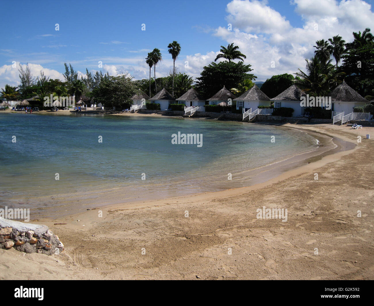Beach shot with deep blue sea and golden sand hi-res stock photography ...