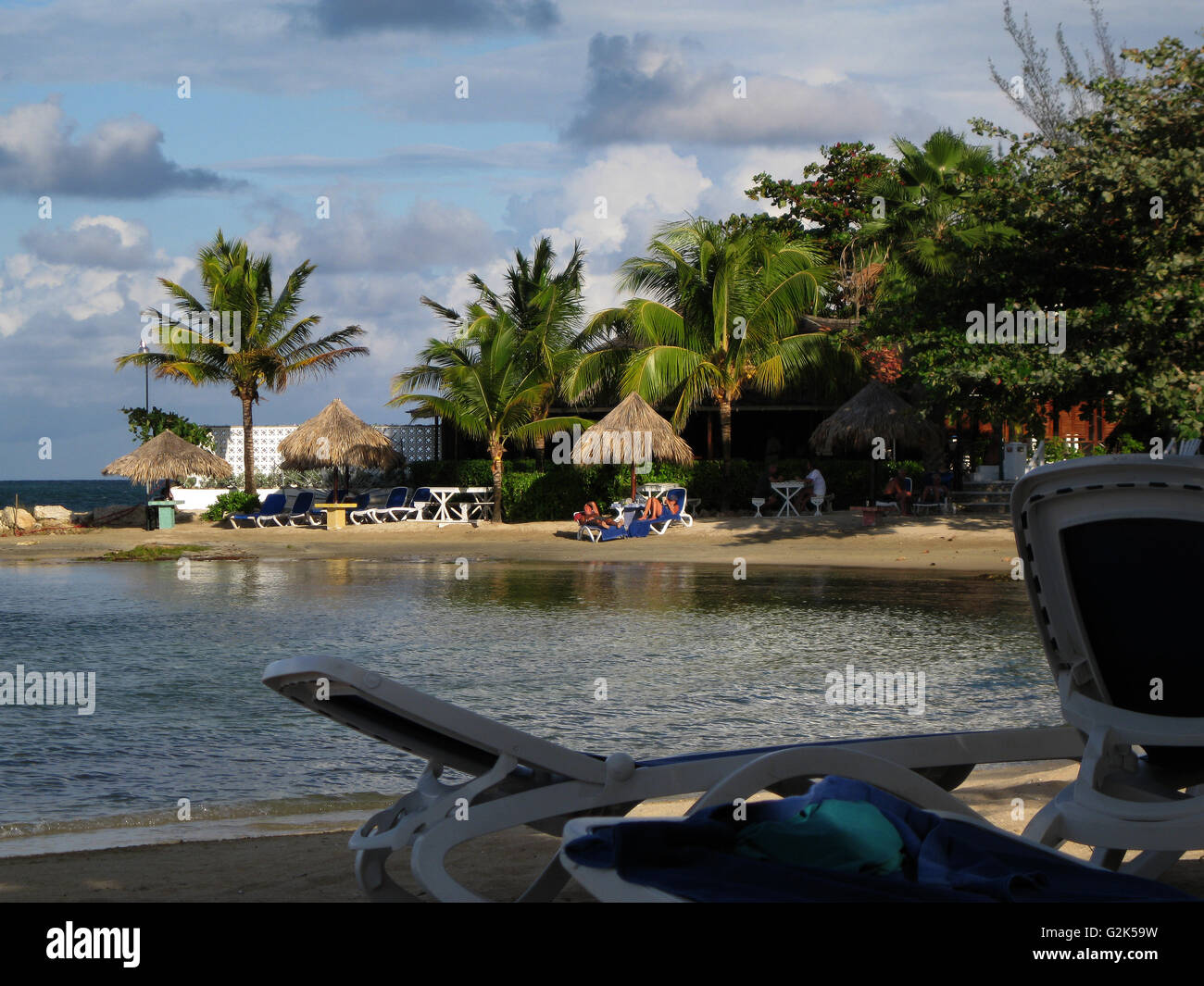Beach shot with deep blue sea and golden sand hi-res stock photography ...