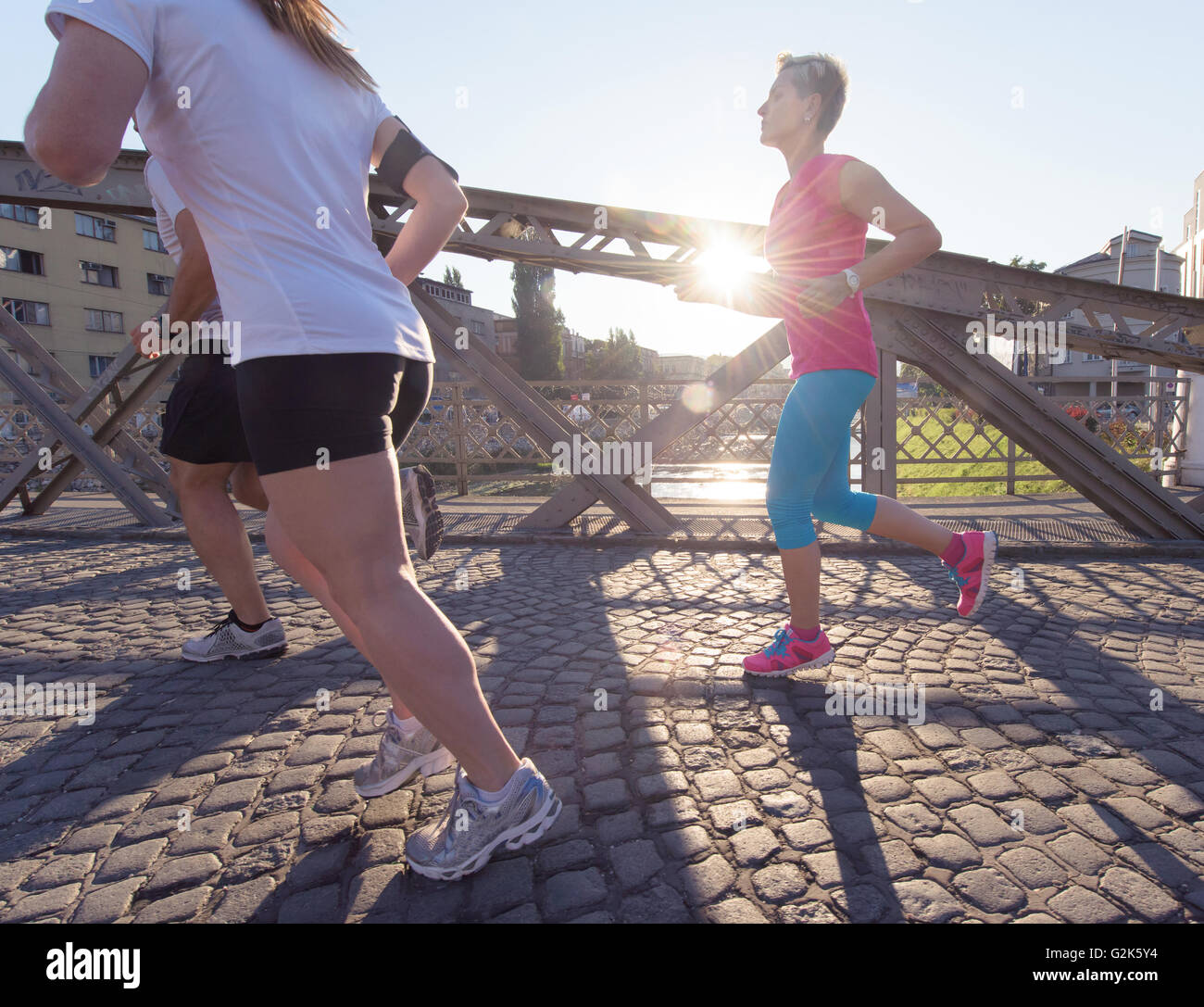 people group jogging runners team on morning training workout with ...