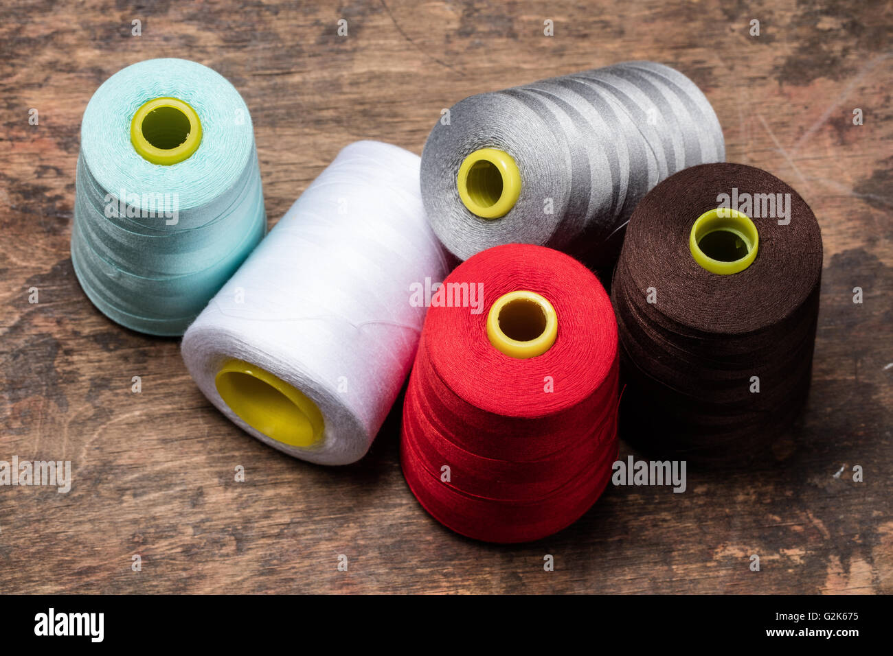 Coloured threads on bobbins hi-res stock photography and images - Alamy