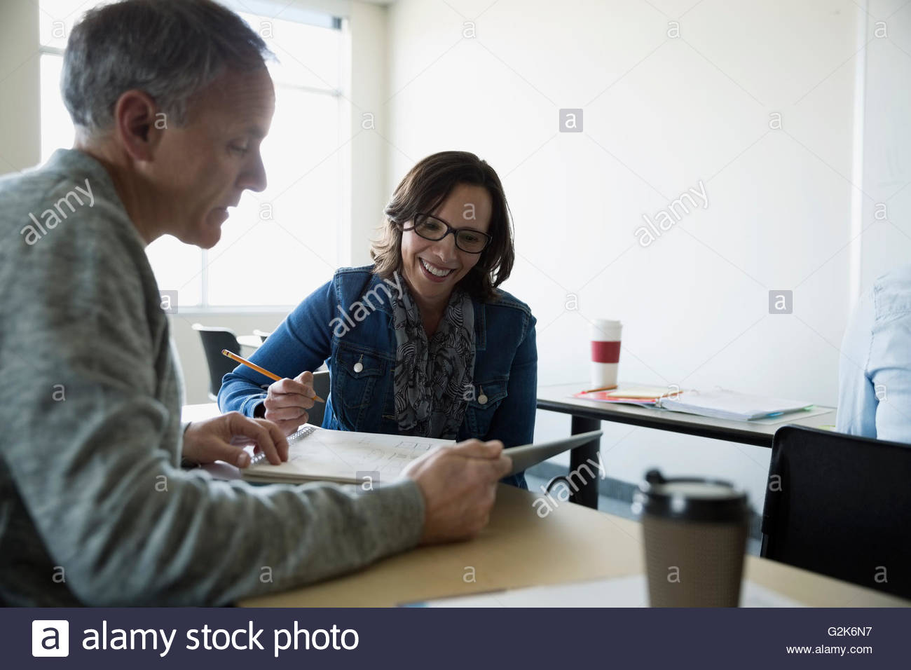 Adult education students studying in classroom Stock Photo - Alamy
