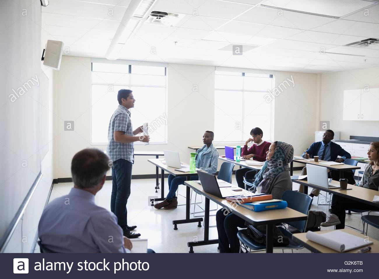 ESL student leading presentation in classroom Stock Photo - Alamy