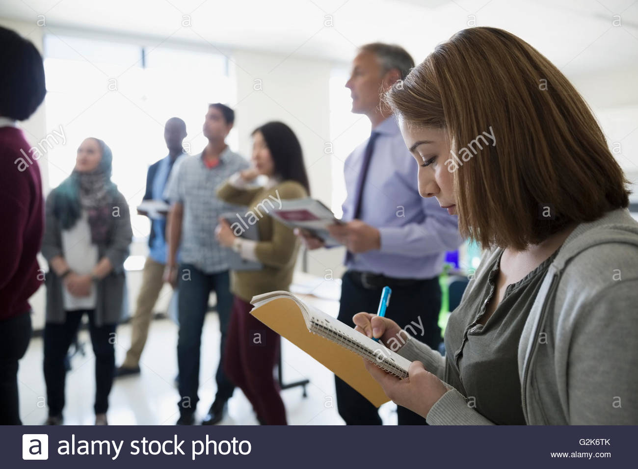 Taking notes in class hi-res stock photography and images - Alamy