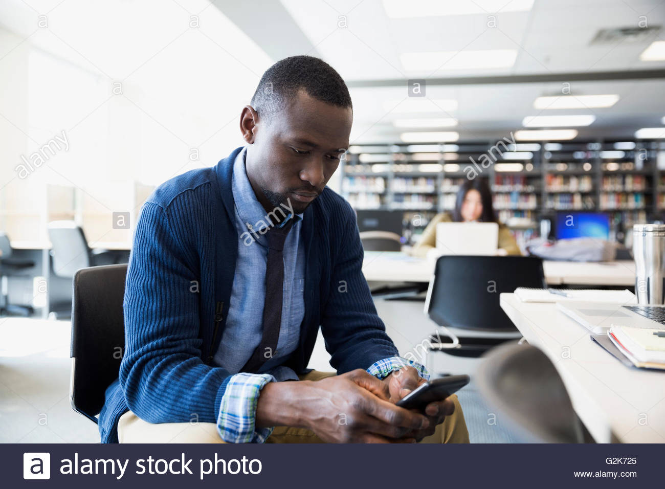 College student texting and reading hi-res stock photography and images ...