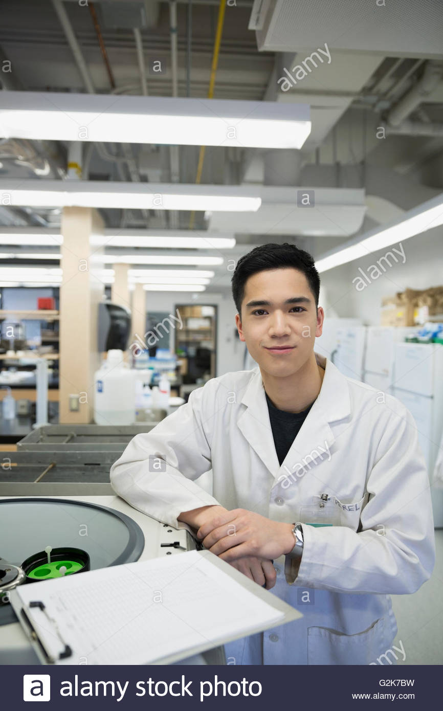 Portrait confident scientist at centrifuge in laboratory Stock Photo ...