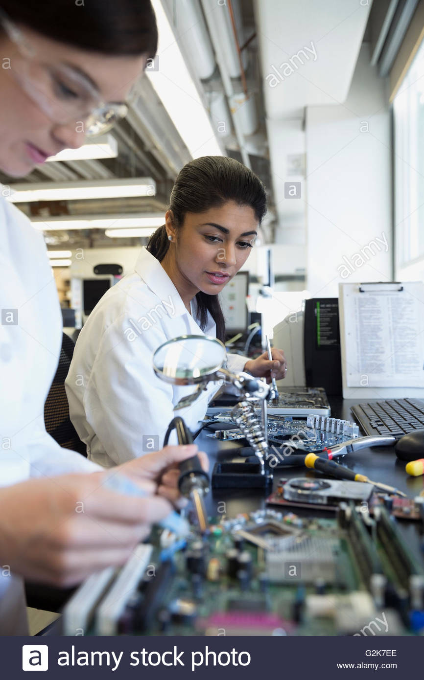 Two engineers looking at computer hi-res stock photography and images ...
