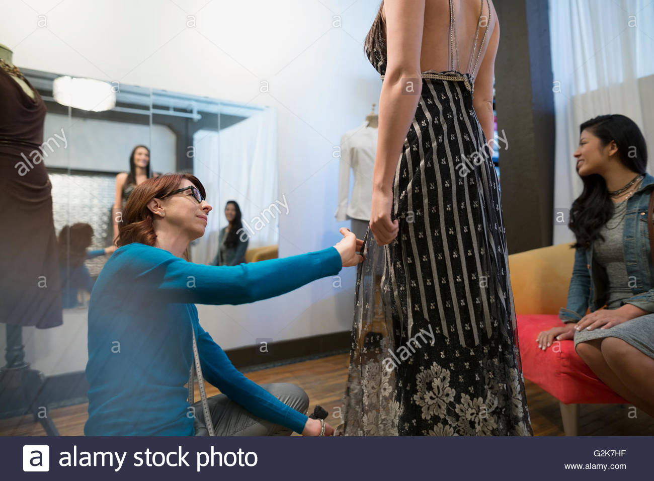 Woman adjusting dress hi-res stock photography and images - Alamy