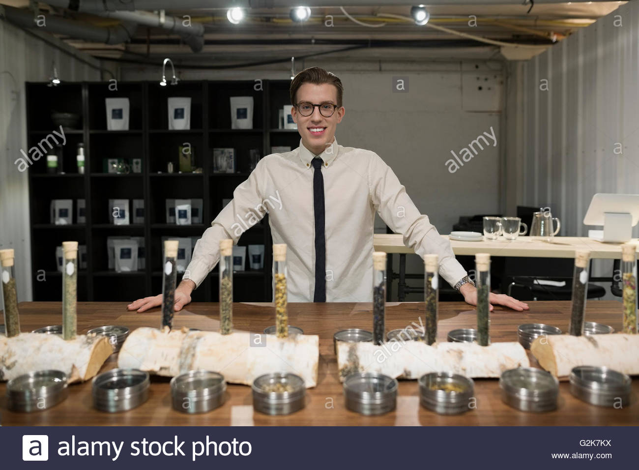 Portrait confident tea shop owner at display Stock Photo - Alamy