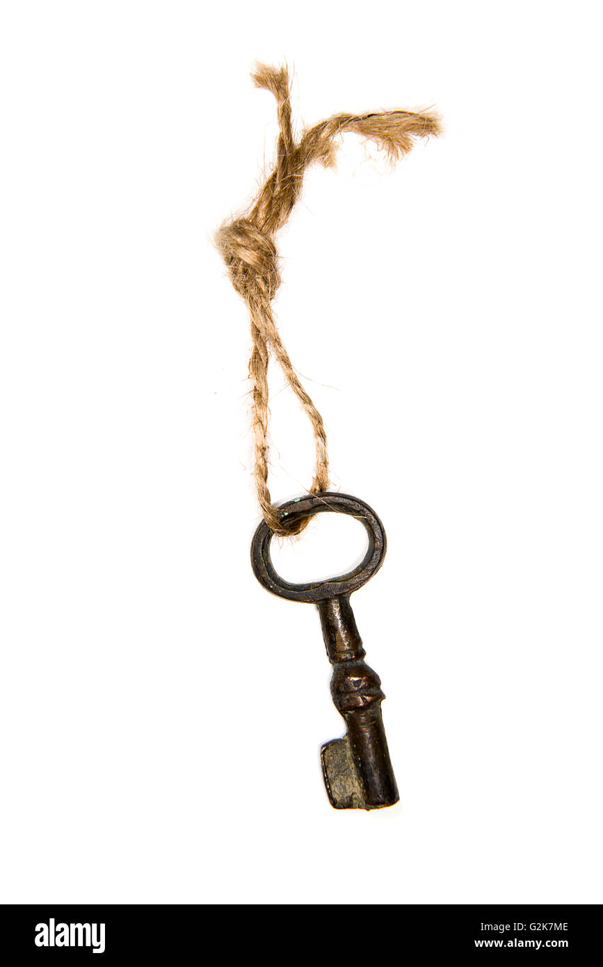 Old key from the door tied with rope Stock Photo - Alamy