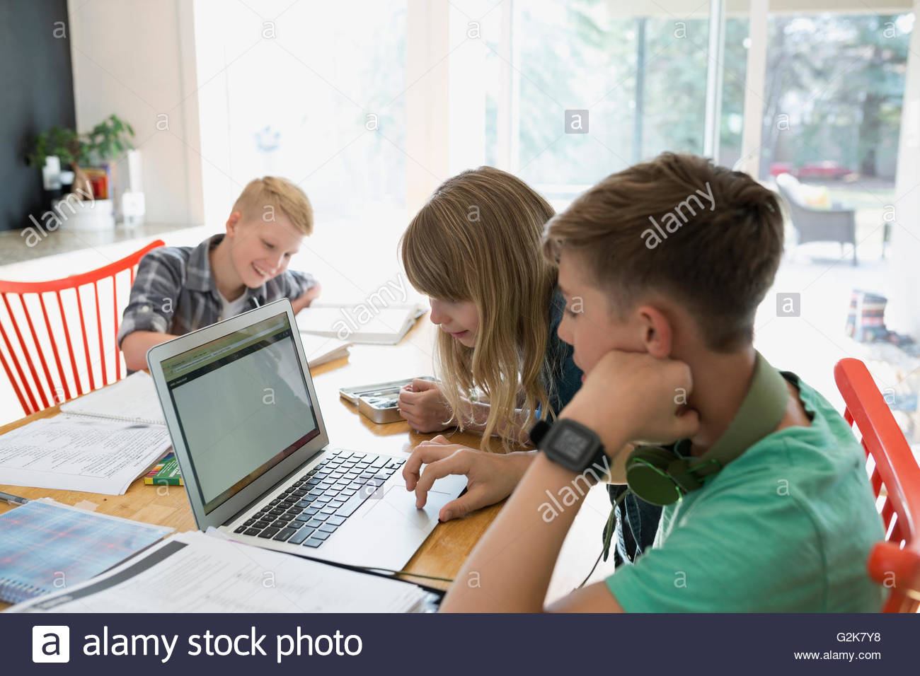 Boy girl doing homework laptop hi-res stock photography and images - Alamy
