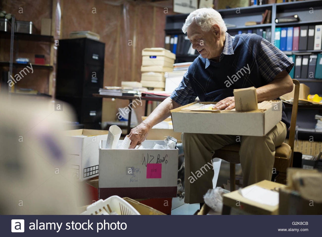 Man reaching into box hi-res stock photography and images - Alamy