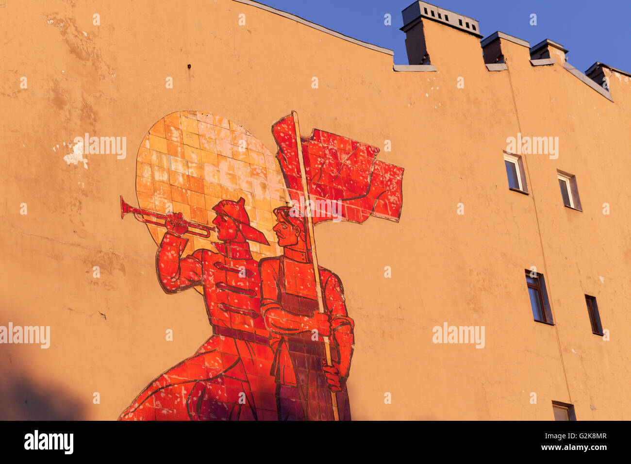 Soviet style painting on the wall of old residential building in St ...