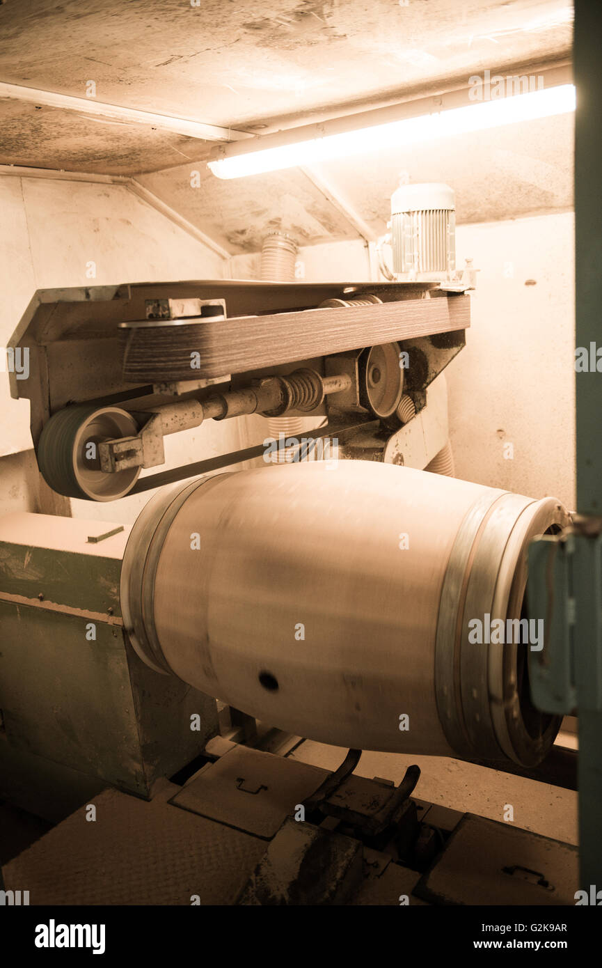 Cleaning a barrel with sanding machine Stock Photo - Alamy