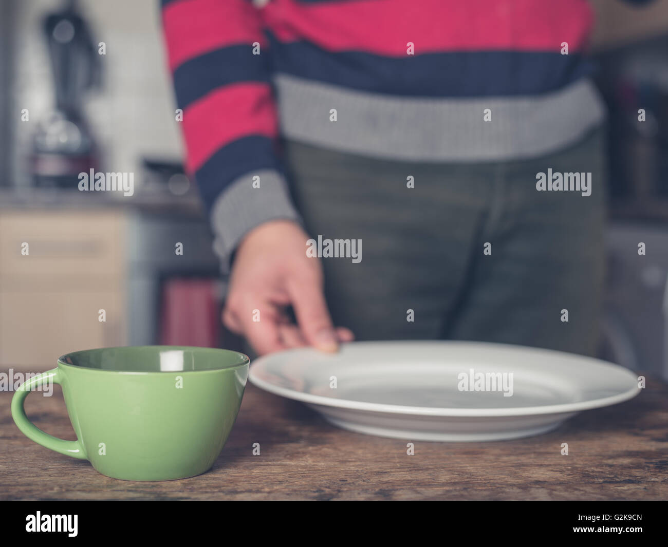 Putting meal plate in kitchen hi-res stock photography and images - Alamy