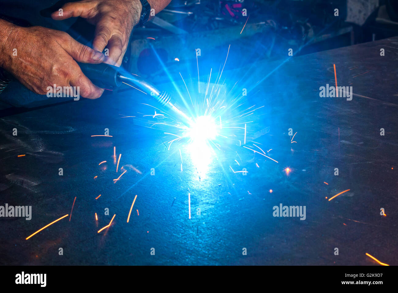 welding close-up bright light and two hands working Stock Photo - Alamy